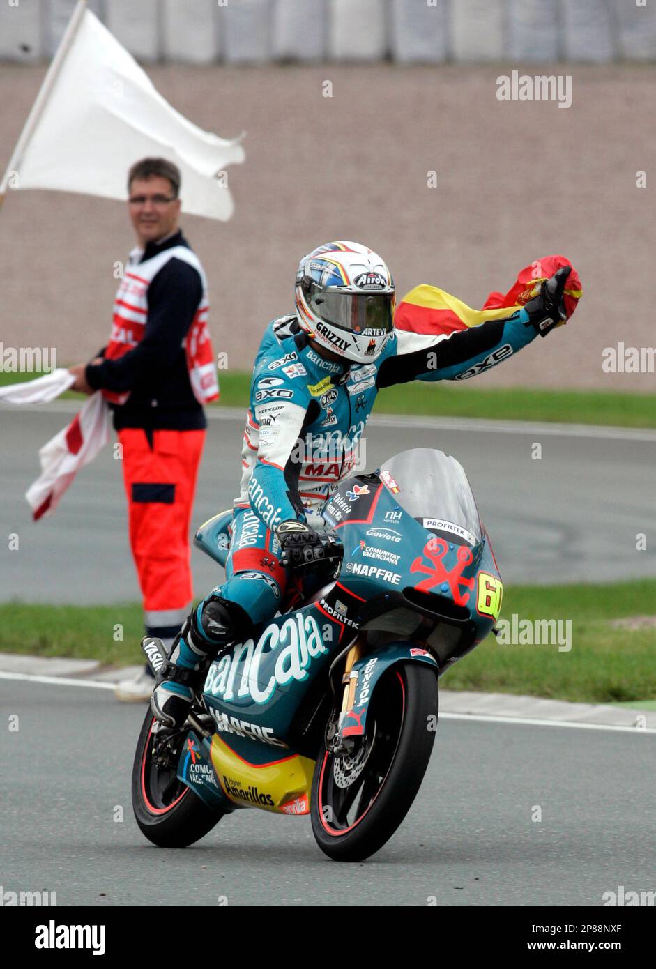 Spain's rider Julian Simon celebrates after he won the 125cc race of ...