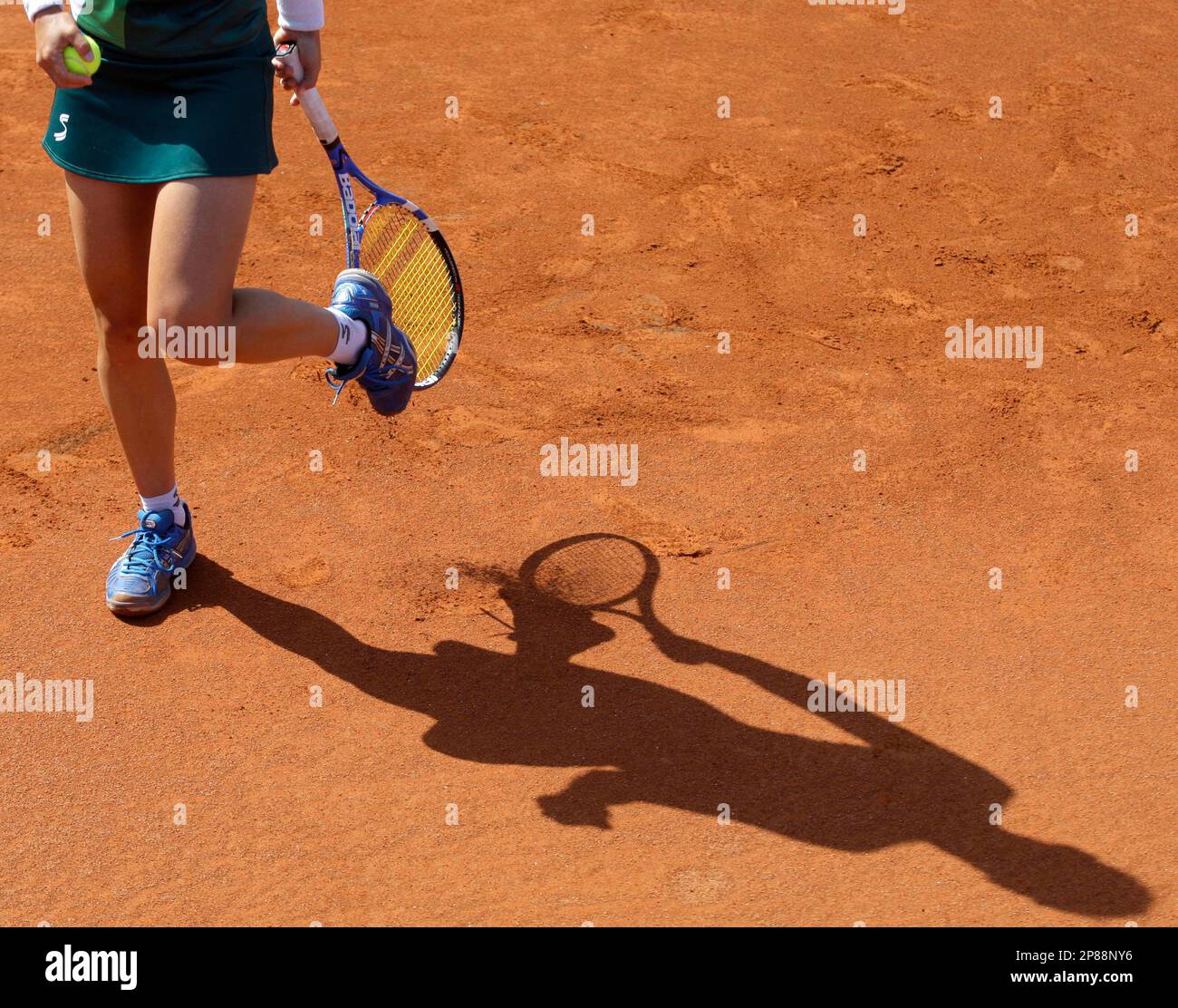 Sybille Bammer from Austria cleans her shoes during the semi-final ...