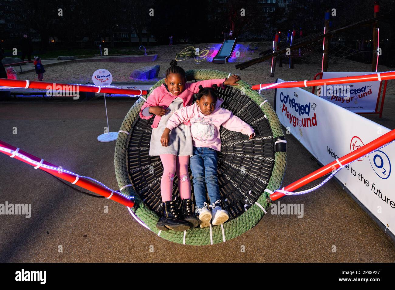 Nicole, aged 7, and Kemi, aged 5, from London play at the Virgin Media ...