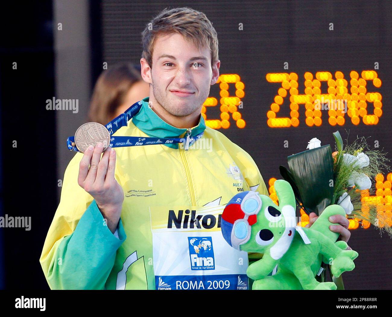 Australia's Matthew Mitcham shows the bronze medal of the men's 1-meter ...