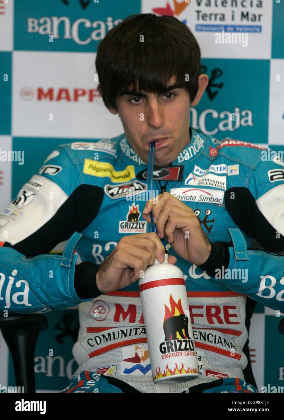 Spain's rider Julian Simon prepares prior to the 125cc free practice ...
