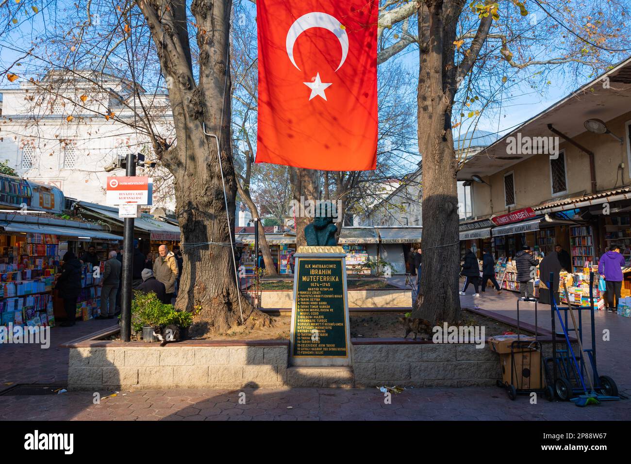 Turkish flag and statue of Ibrahim Muteferrika in Sahaflar Carsisi or ... Turkish flag and statue of Ibrahim Muteferrika in Sahaflar Carsisi or ...