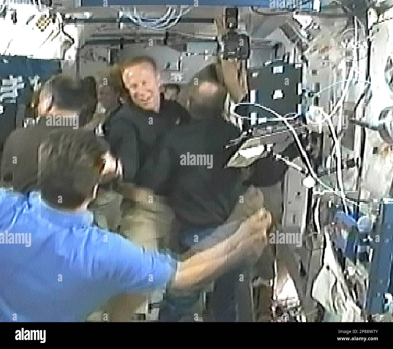 In this image rendered from video and released by NASA, the crew of ...