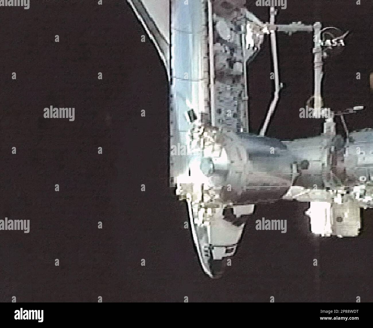 In this image rendered from video and released by NASA, space shuttle ...