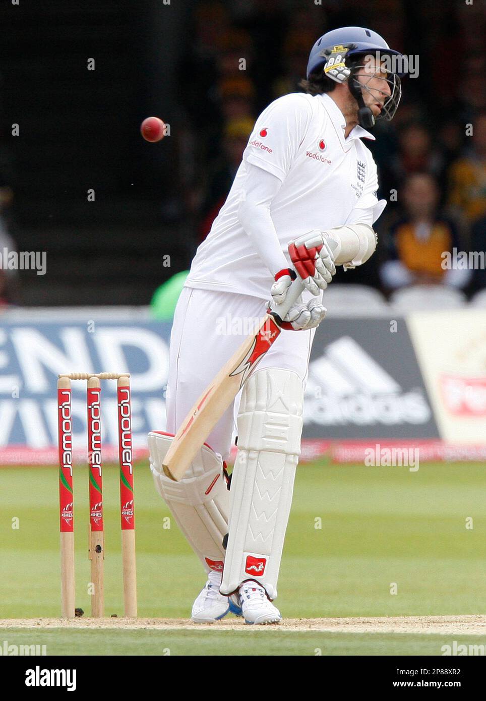 England's Graham Onions plays a shot off the bowling of Australia's ...
