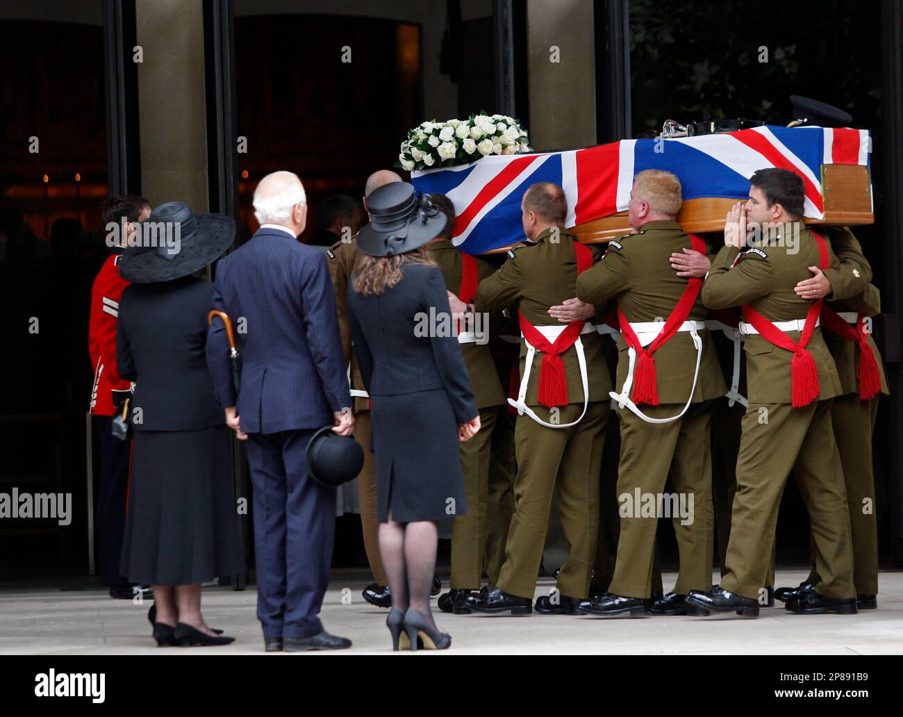 British soldiers from the Welsh Guards carry the coffin of Lieutenant ...