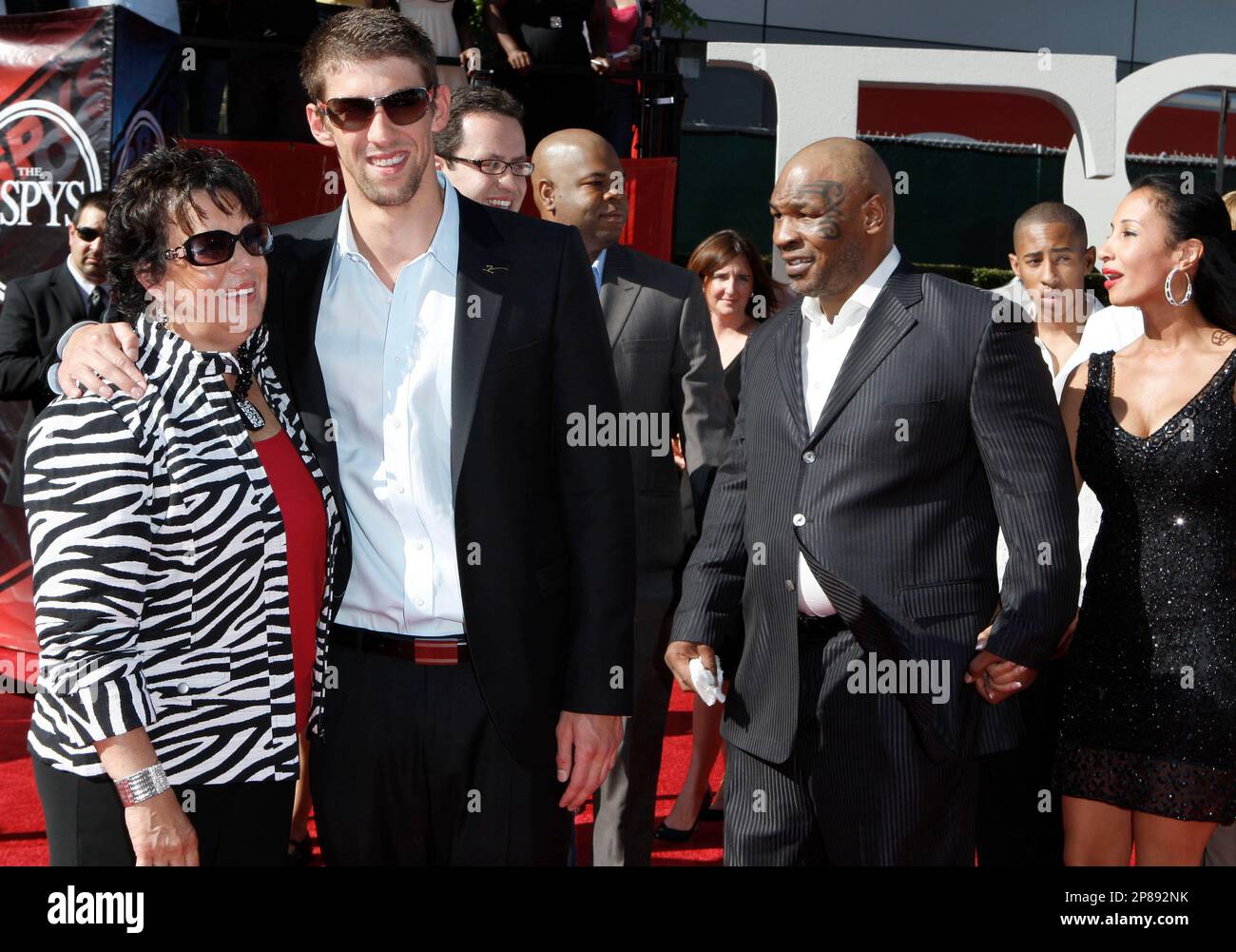 Michael Phelps, second left, and his mother Debbie arrive at the ESPY ...