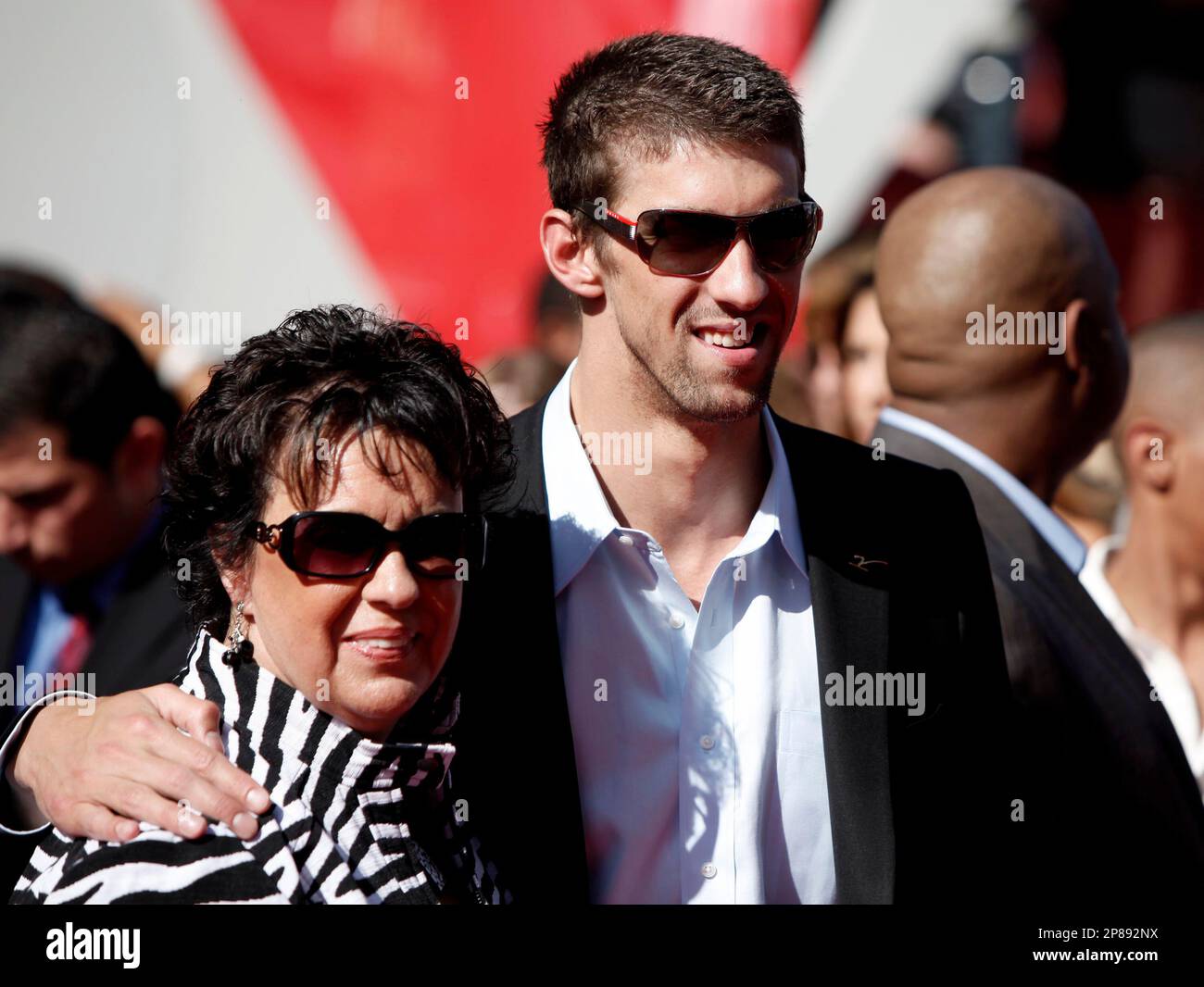 Michael Phelps, right, and his mother Debbie arrive at the ESPY Awards ...