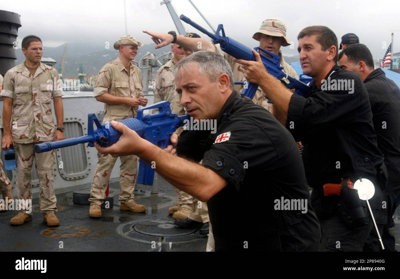 Georgian coast guards wield mock guns during training exercises of U.S ...