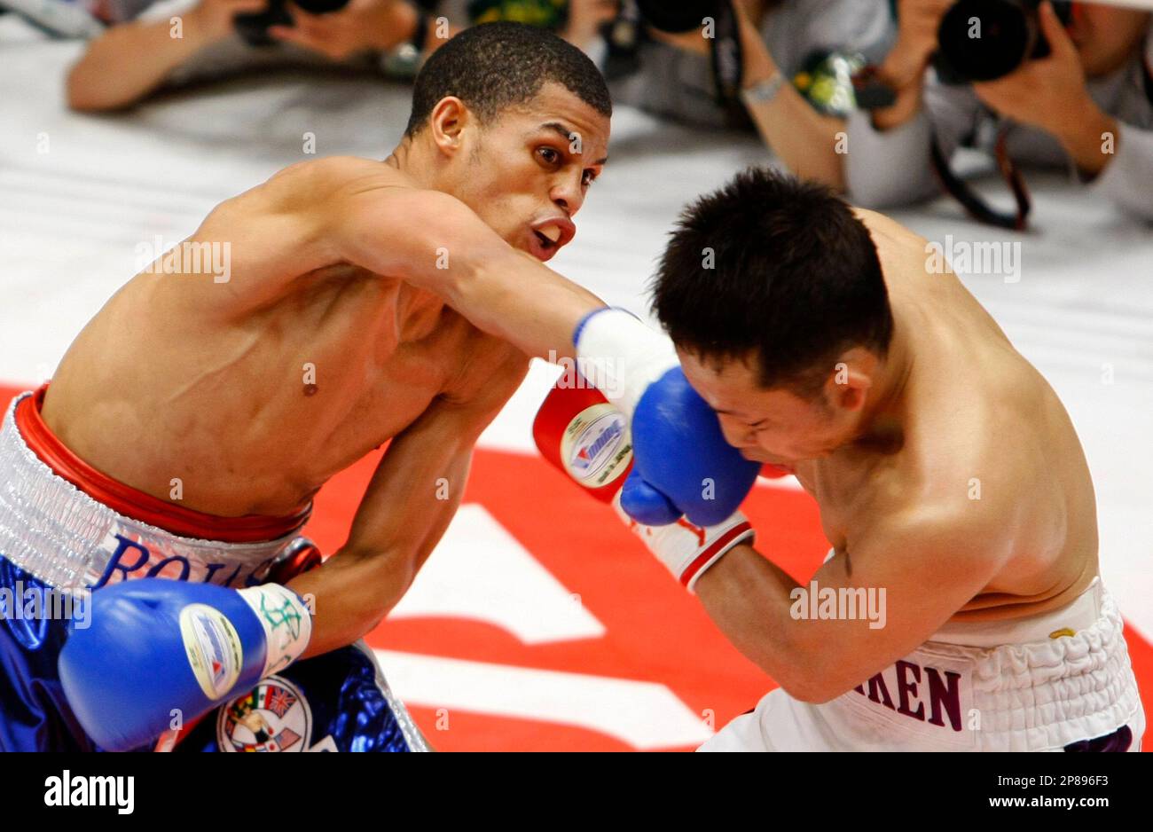 Dominican Republic challenger Elio Rojas, left, sends his right to ...