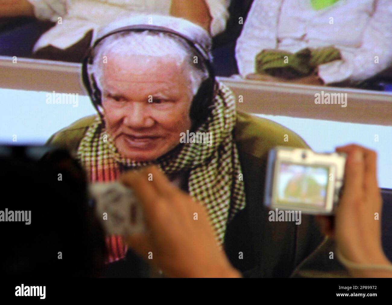 Photographers take picture of Mam Nai, a former Khmer Rouge Chief of ...