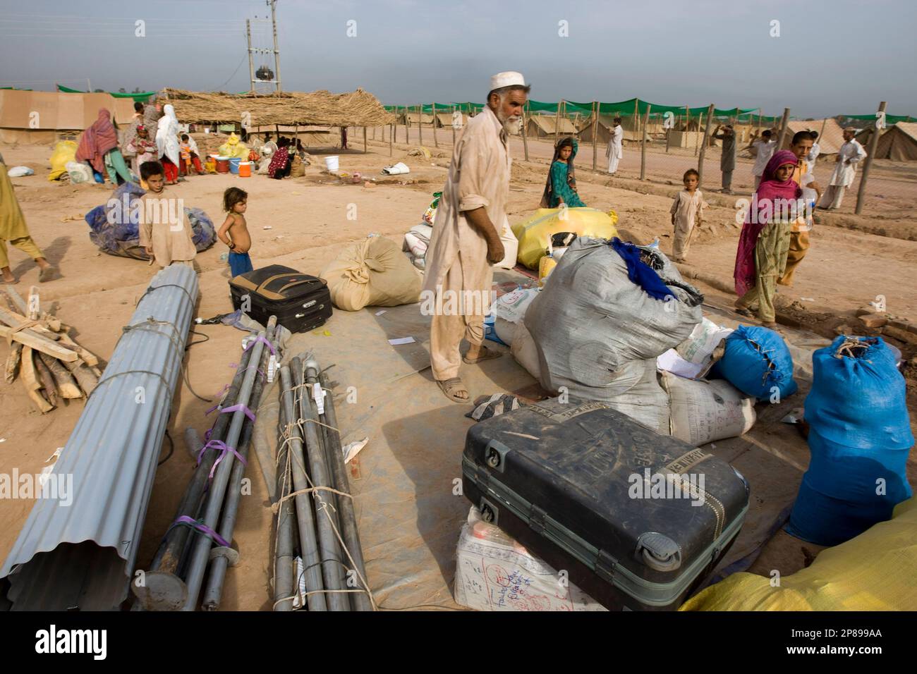 Pakistani displaced man packs his belongings as he prepared to return ...