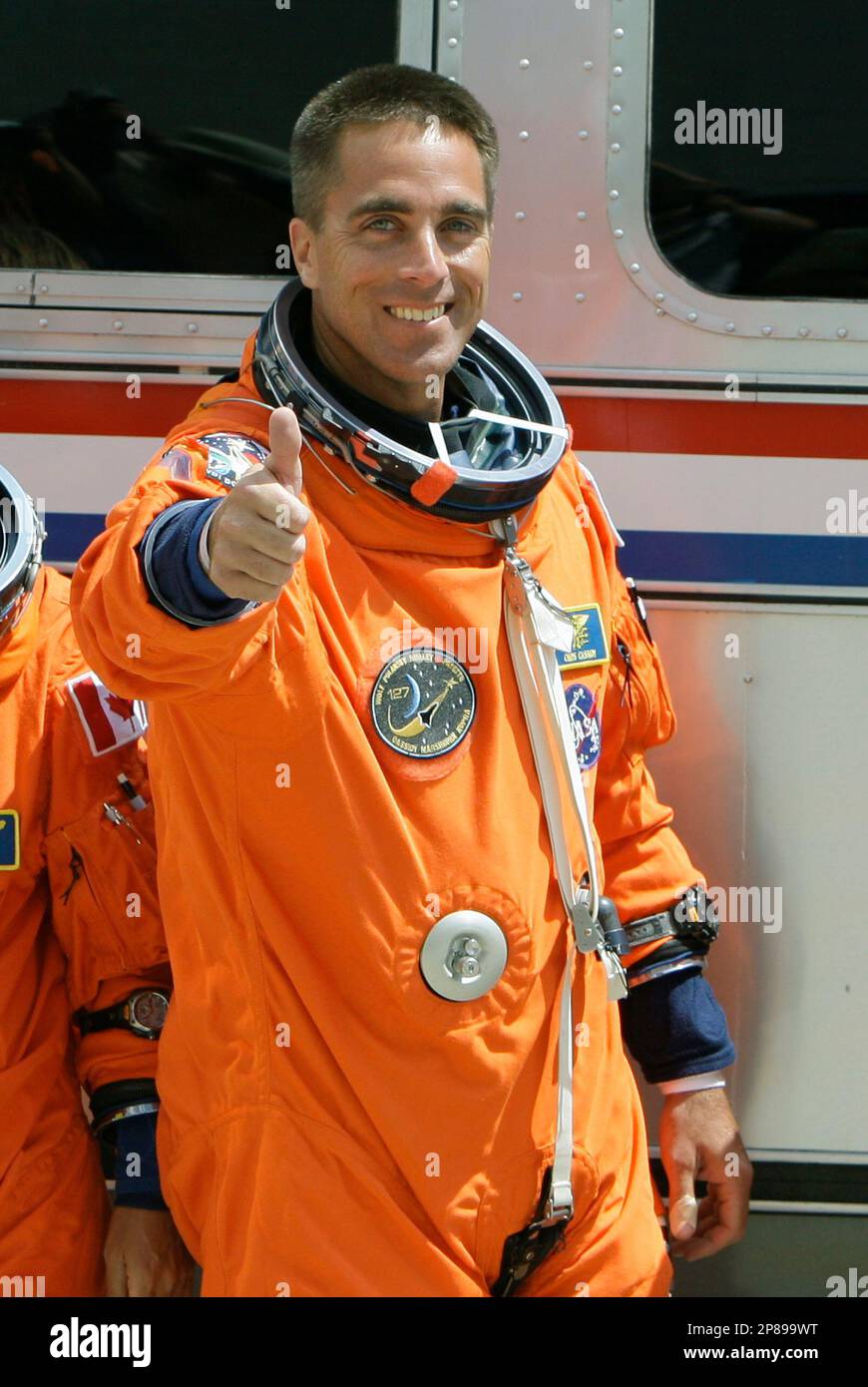Space shuttle Endeavour mission specialist Christopher Cassidy gives ...