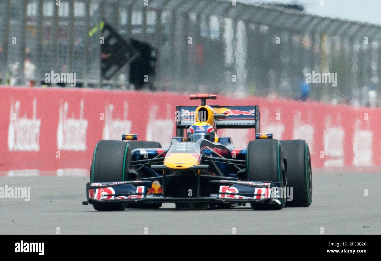 Red Bull driver Mark Webber of Australia passes the pit wall during the Formula One race at the ...