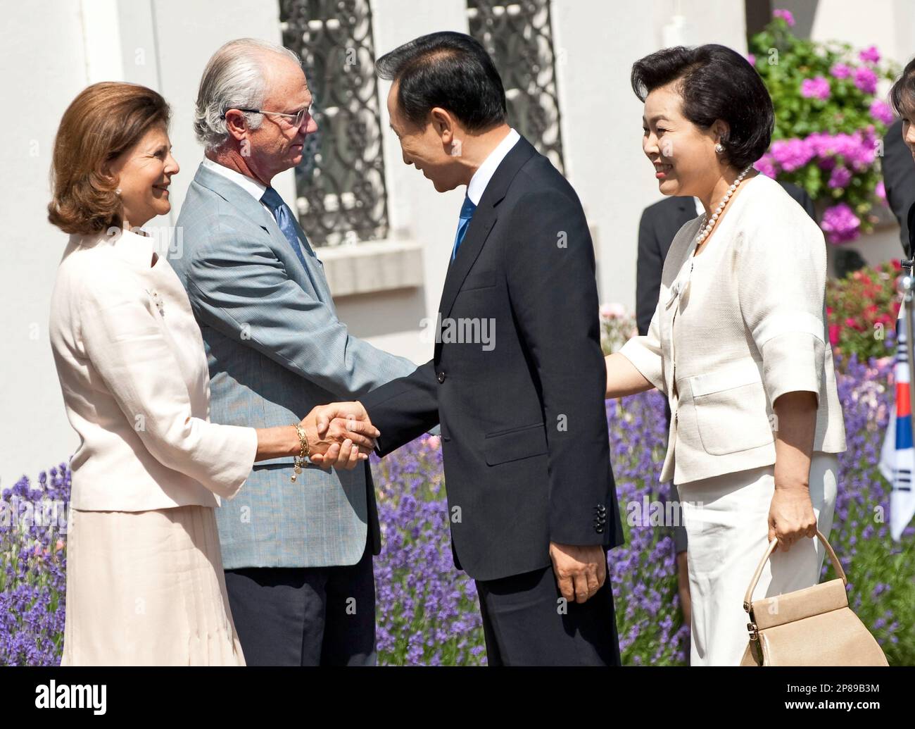Sweden's Queen Silvia, left, and King Carl Gustaf, second left, welcome ...