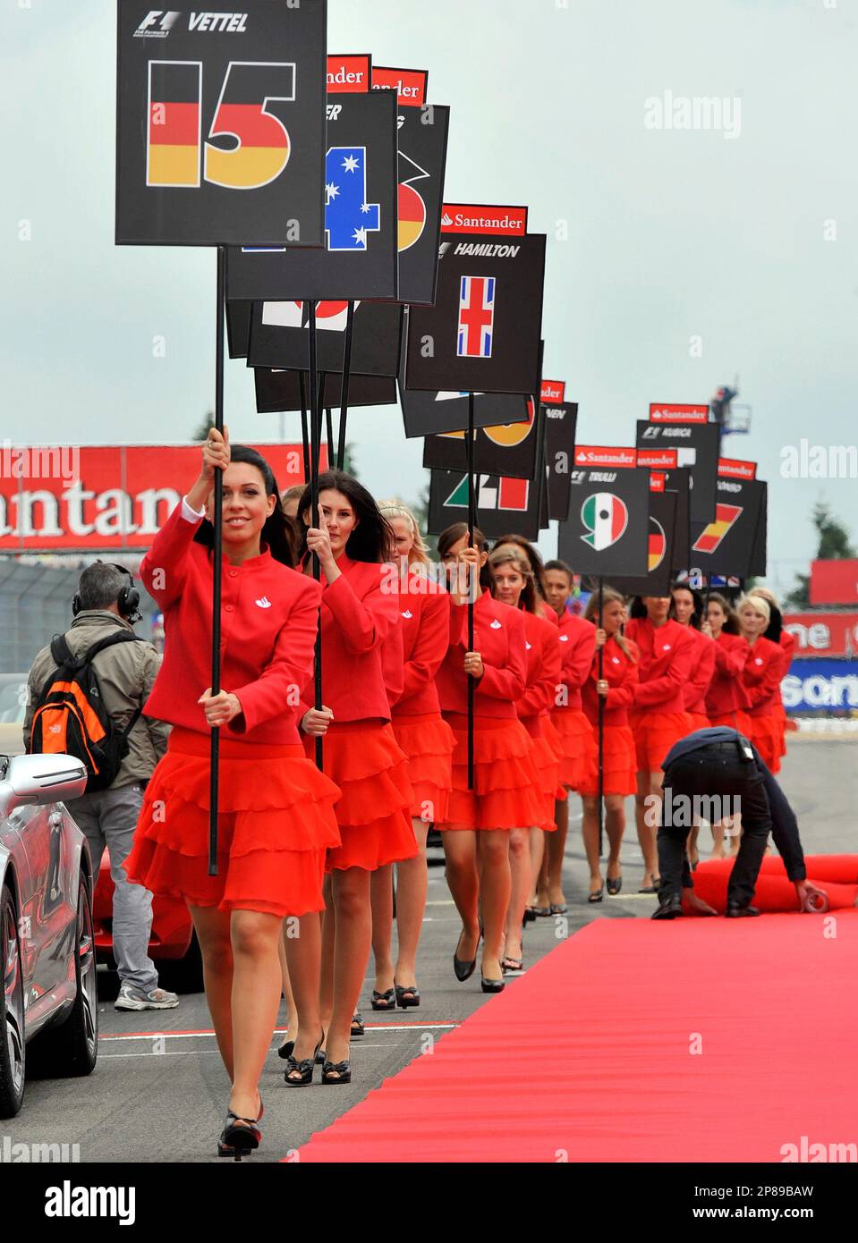 Grid girls arrive for the drivers parade prior to the start of the ...