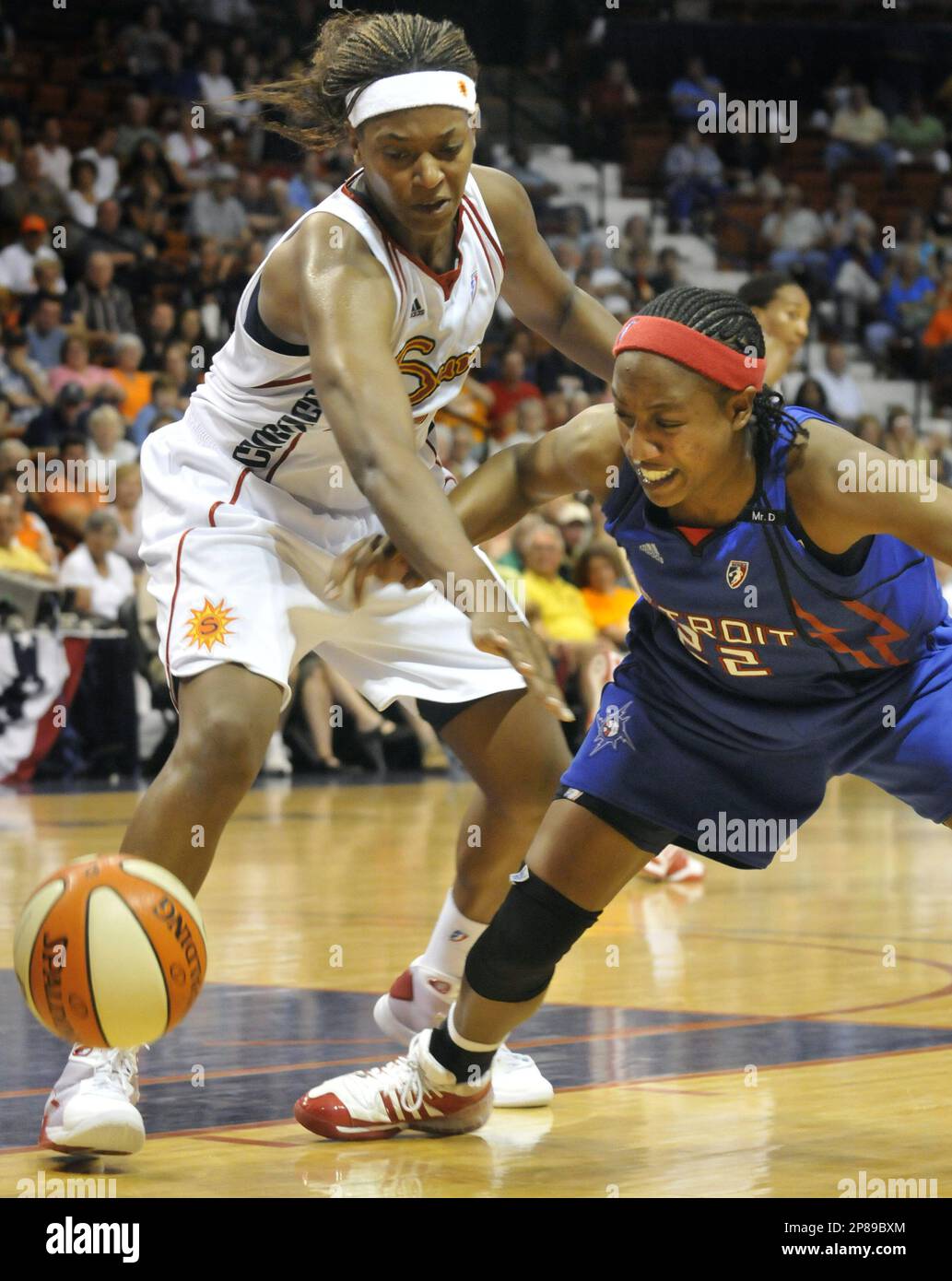 Connecticut Sun's Asjha Jones, left, Detroit Shock's Alexis Hornbuckle ...