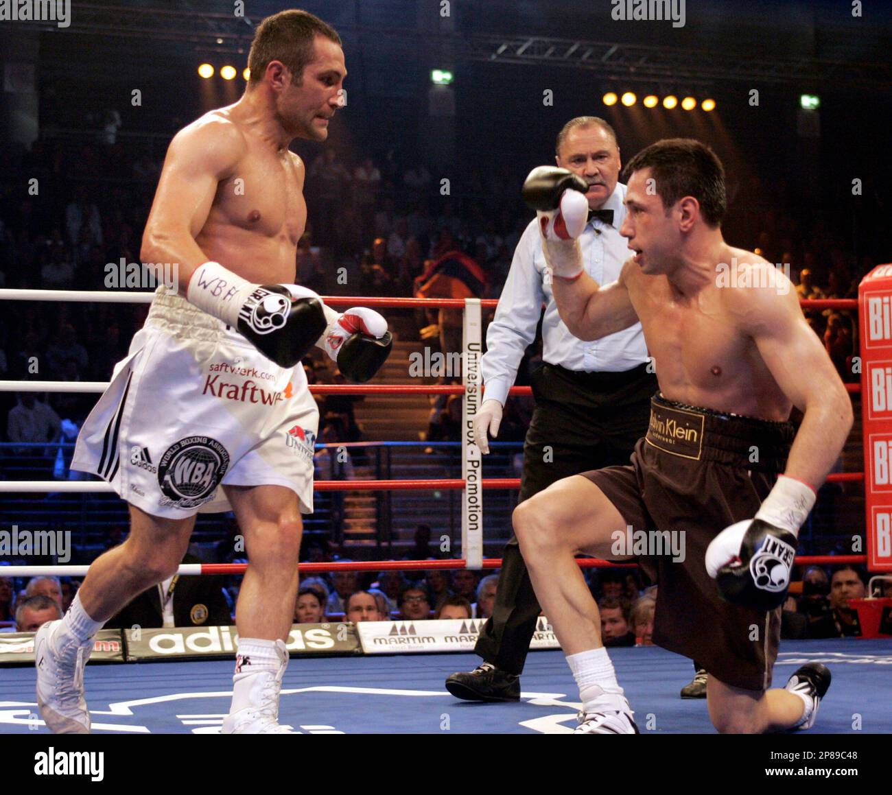 WBA world champion Felix Sturm, right, falls to one knee during his WBA ...