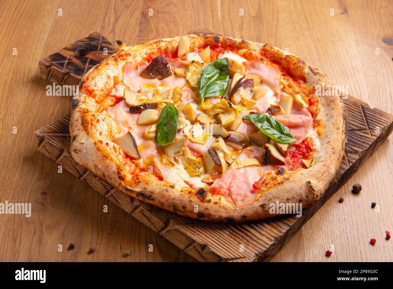 Capricciosa pizza with cheese, bacon, tomatoes, mushrooms and basil ...