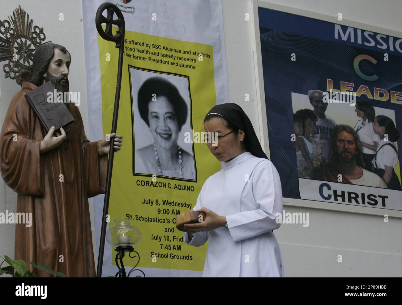 A tarpaulin poster of former President Corazon "Cory" Aquino, is placed ...
