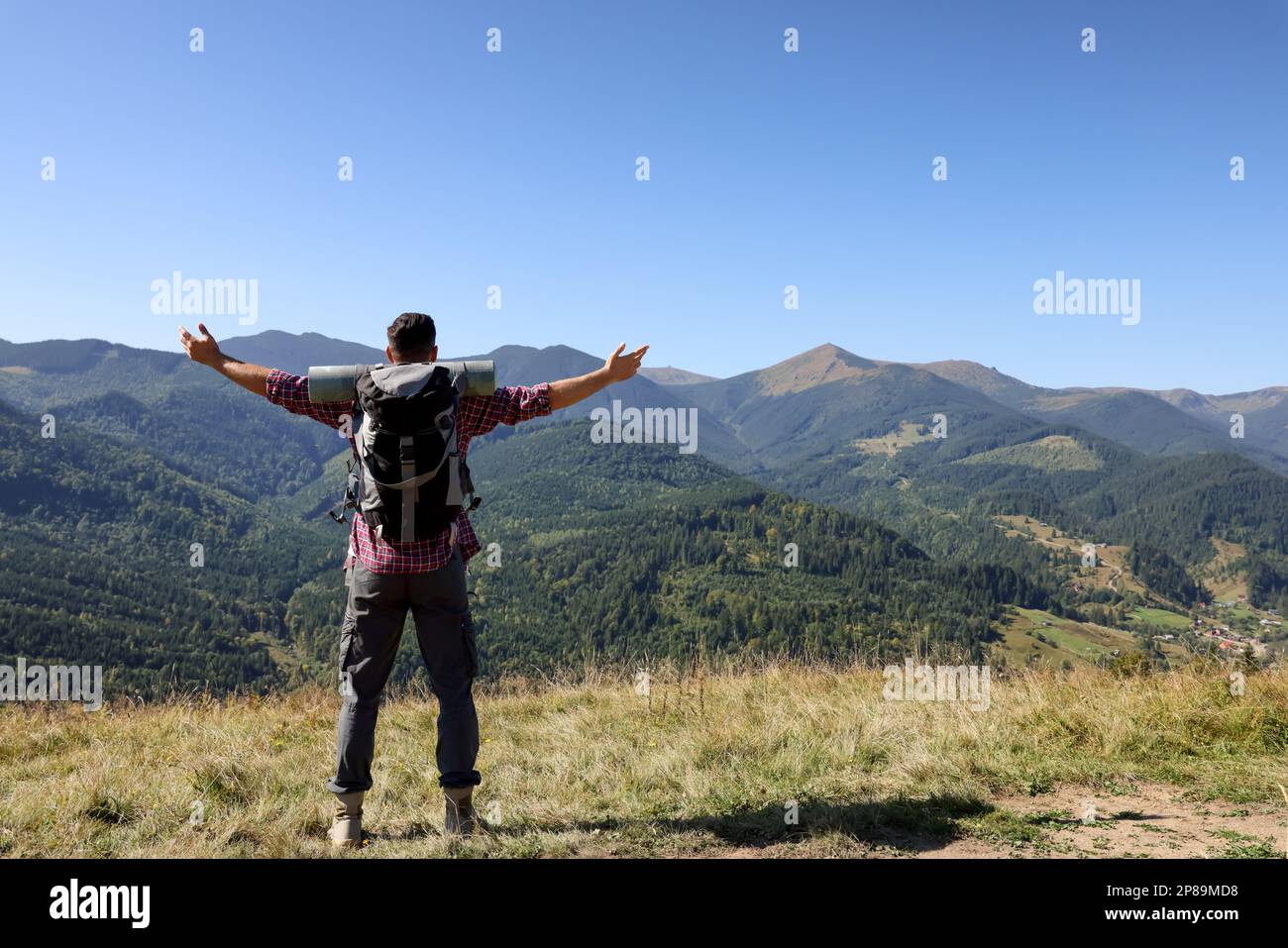 Back view happy man backpack hi-res stock photography and images - Alamy