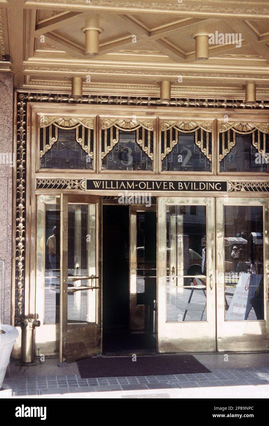 The brass doors and fixtures of the William Oliver Building gleam anew ...