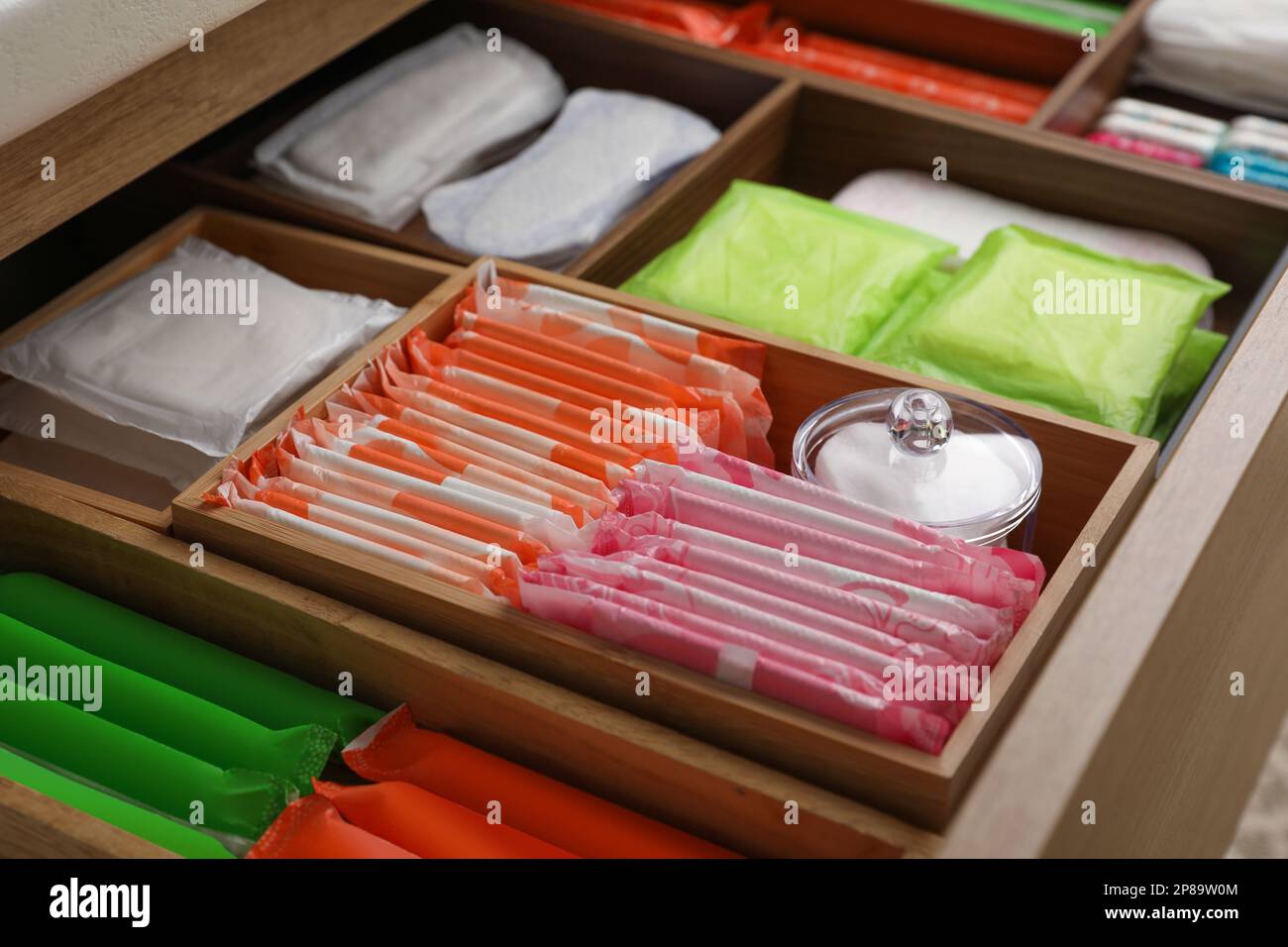 Storage of different feminine hygiene products in wooden drawer ...