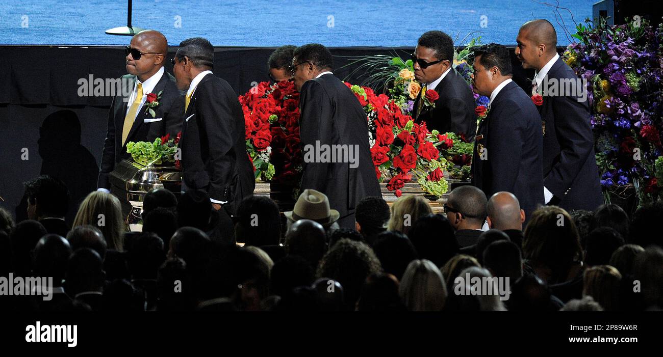Michael Jackson's brothers carry his coffin after the memorial service ...