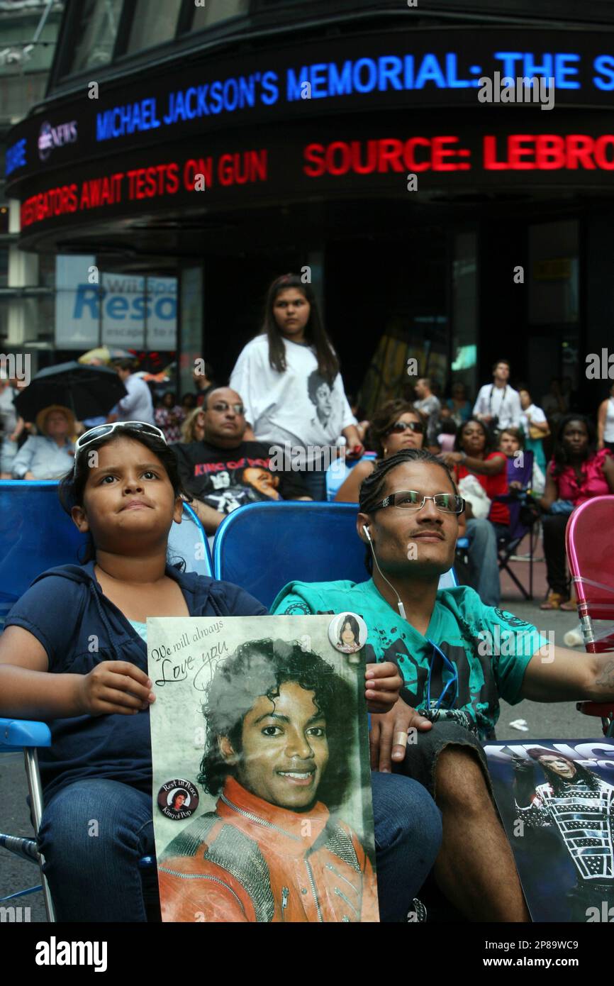Jason Molina, right, from the Bronx and his daughter Kayla, 11, watch ...