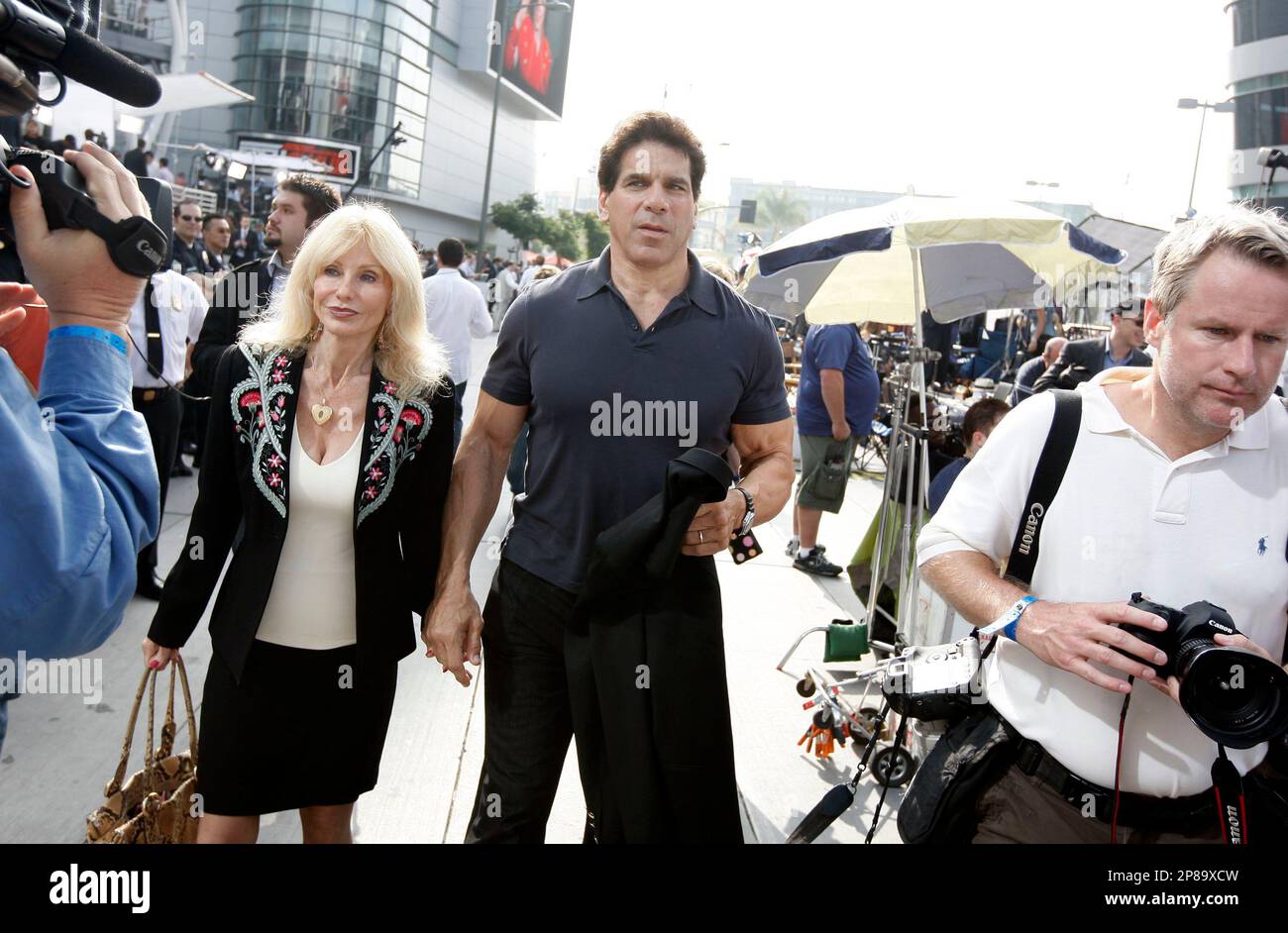 Lou Ferrigno, second right, and wife Carla arrive at the public ...