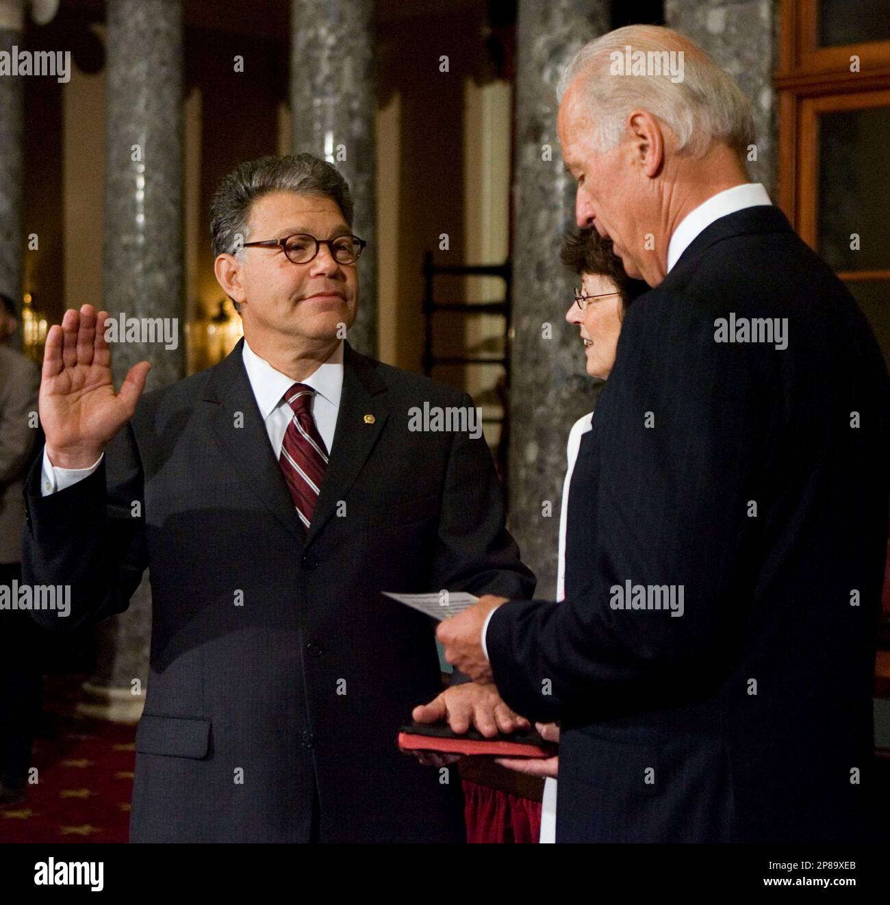 Sen. Al Franken, D-Minn., left, with his wife Franni holding the bible ...