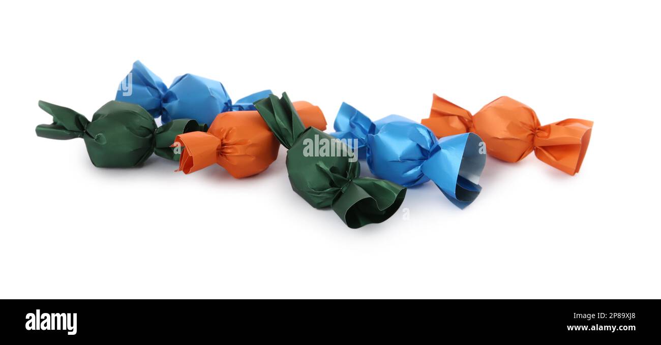 Many candies in colorful wrappers on white background Stock Photo - Alamy