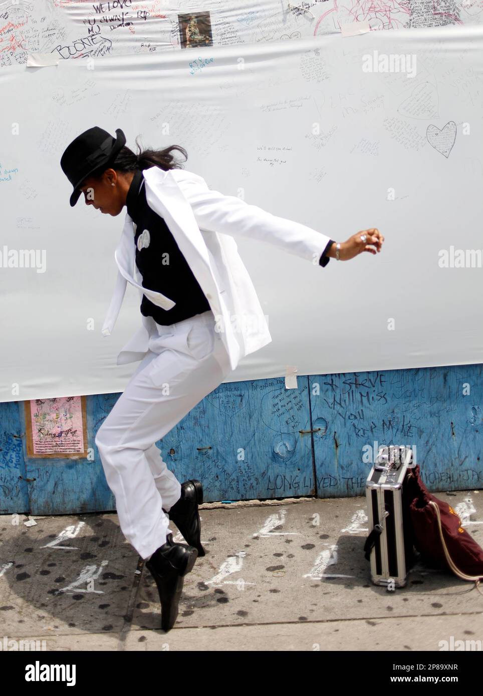 Moses Harper shows off her dance moves in front of banner in tribute to ...