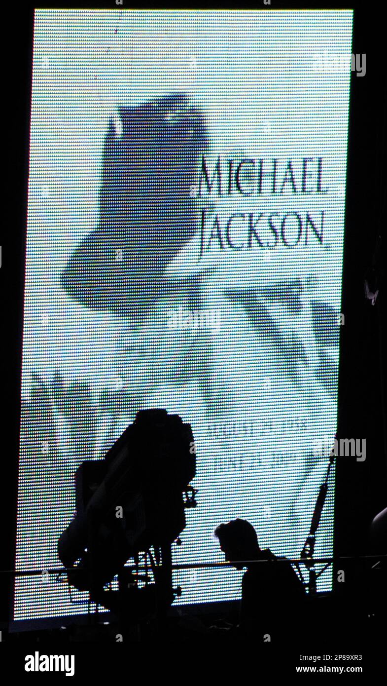 Lighting technicians and stage hands set up before the start of pop ...