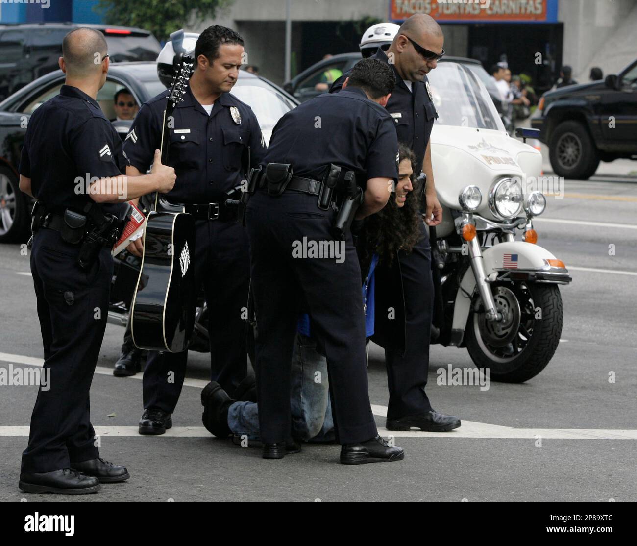 A fan is arrested outside Michael Jackson's public memorial service at ...