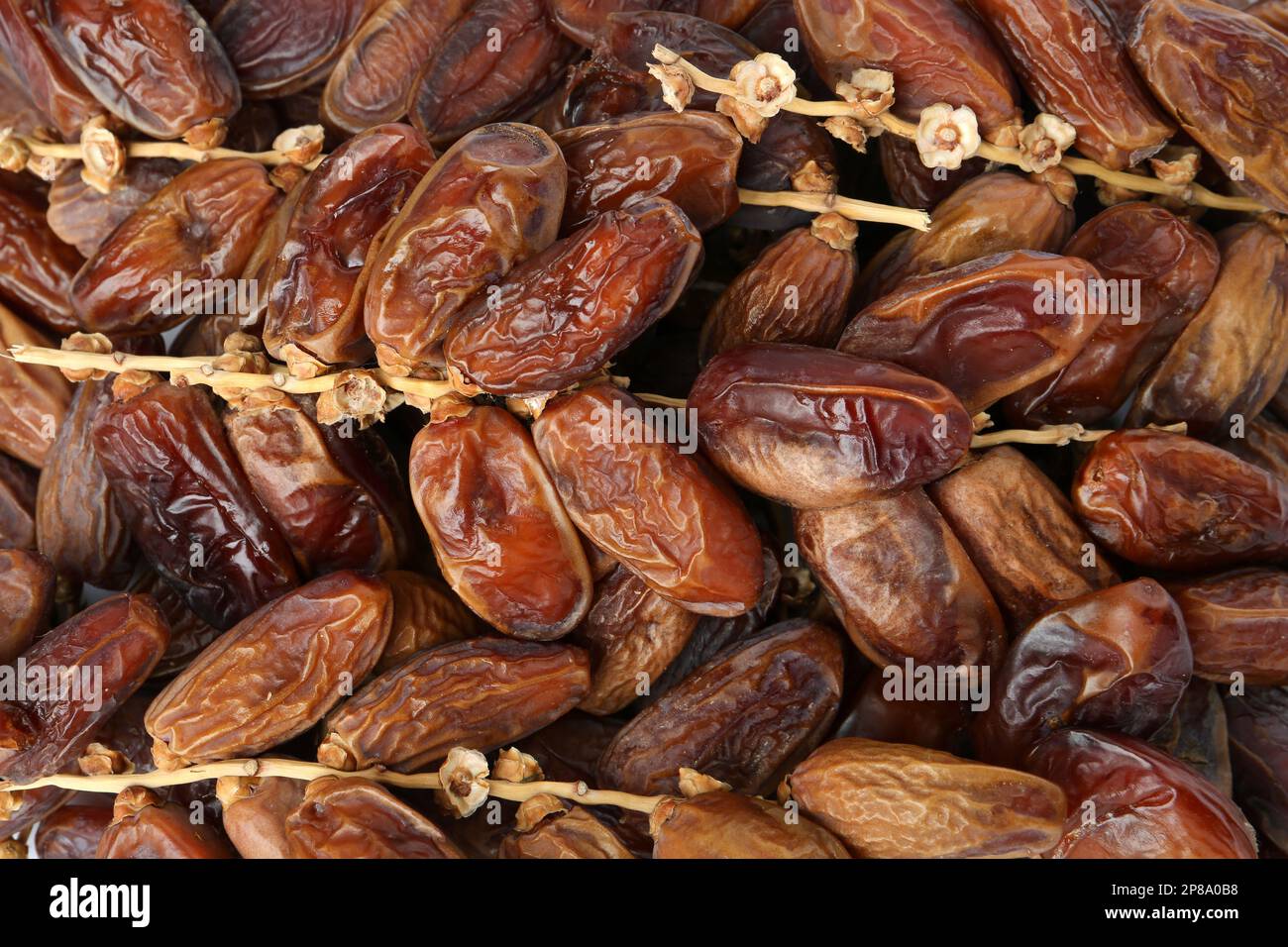 Sweet dried dates on branches as background, top view. Healthy snack ...