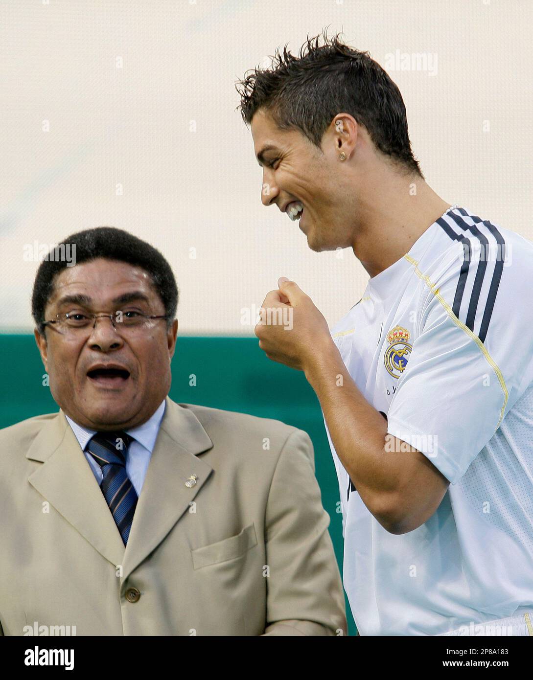 Real Madrid new soccer player Cristiano Ronaldo, right, talks to ...