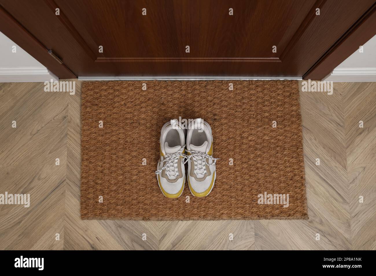 Shoes on door mat hi-res stock photography and images - Alamy