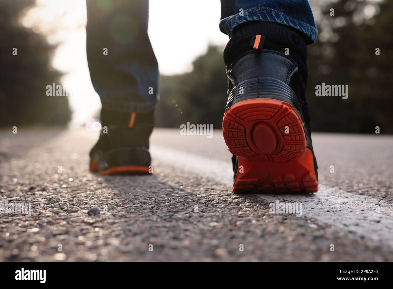 Man going along road hi-res stock photography and images - Alamy
