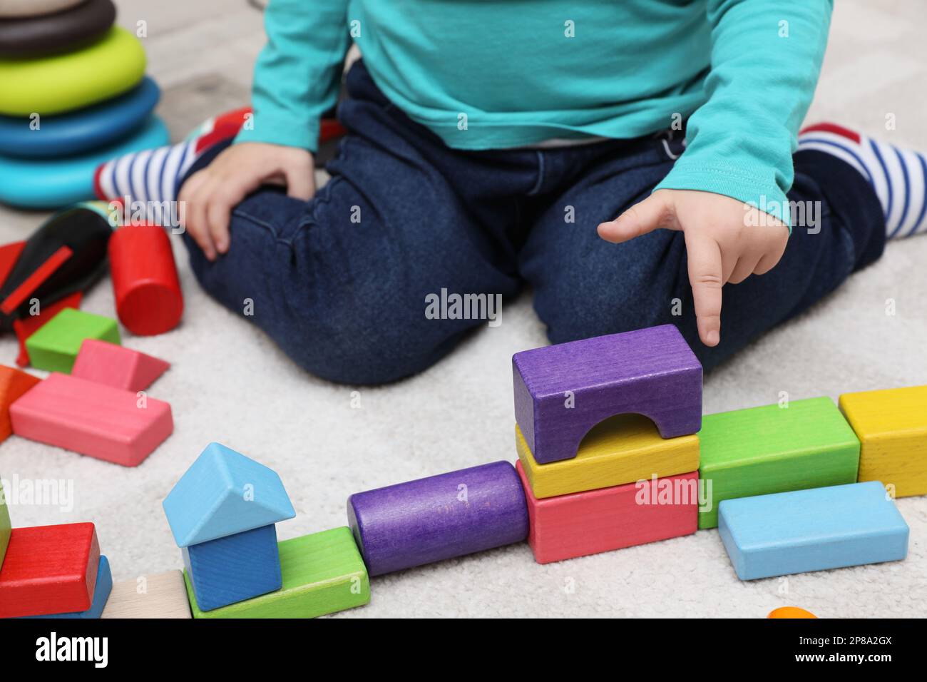 Baby boy stacking blocks hi-res stock photography and images - Alamy