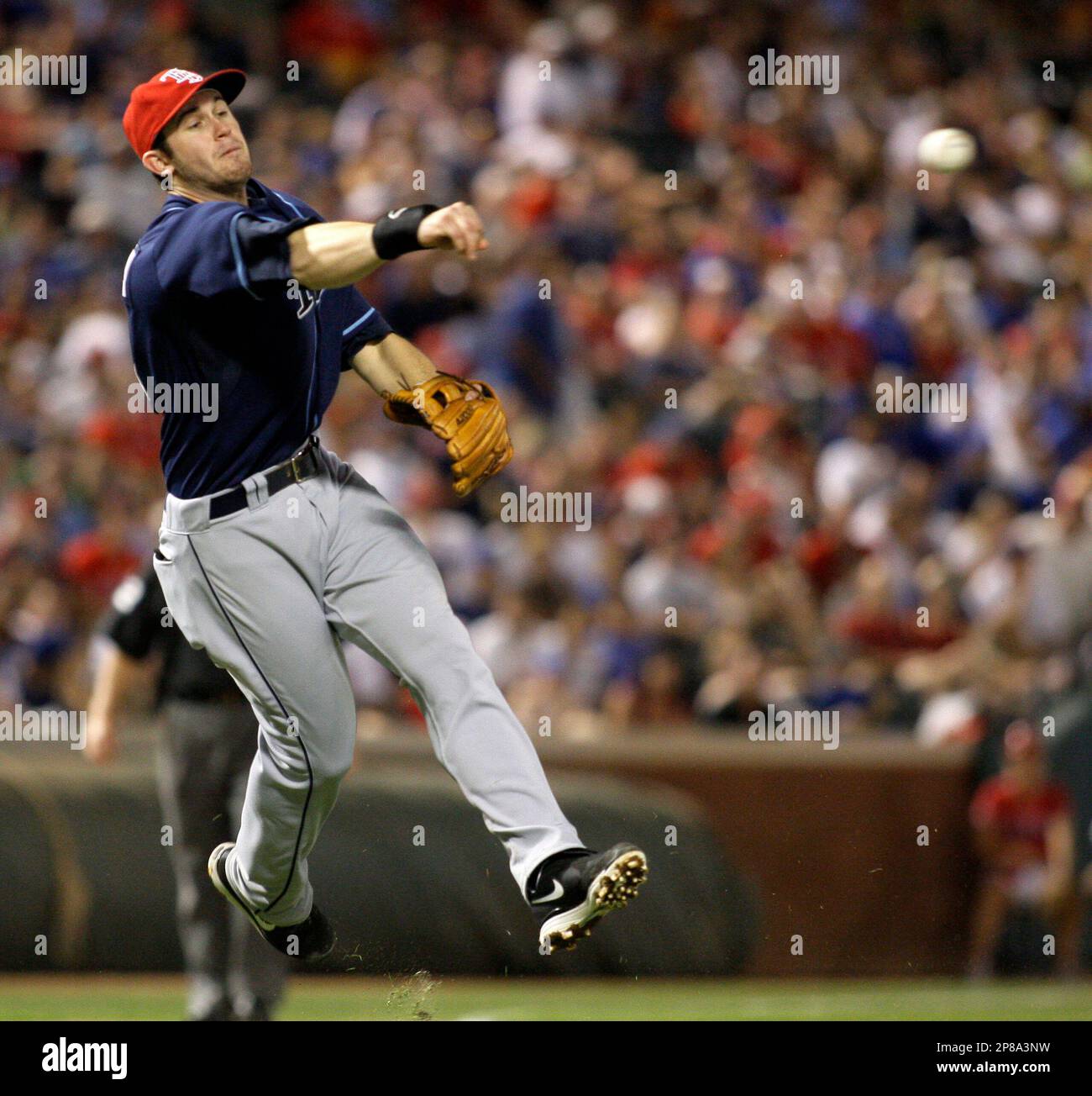 Tampa Bay Rays third baseman Evan Longoria throws to first after ...