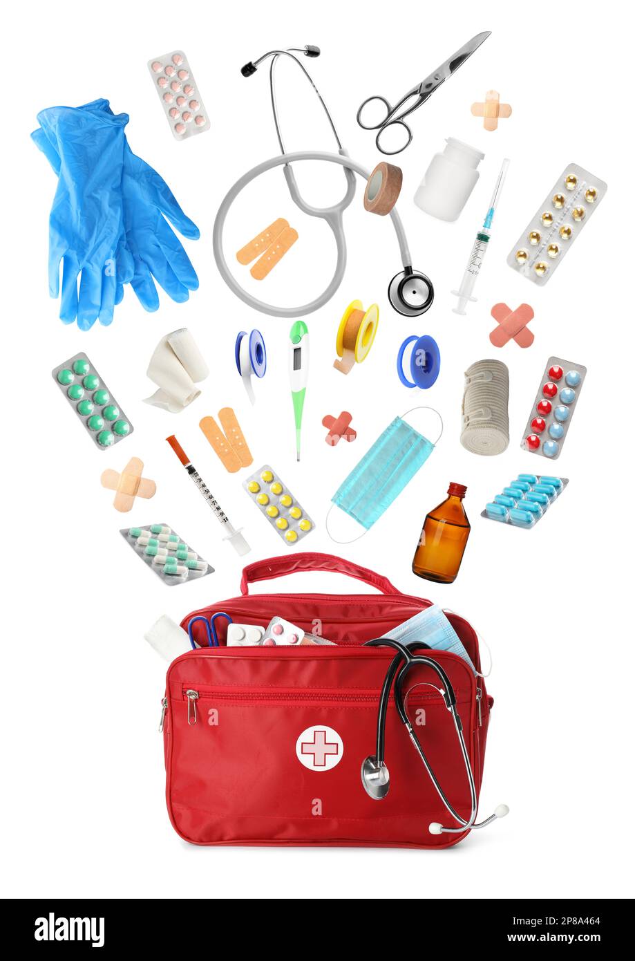First aid kit. Different medical supplies falling on white background ...