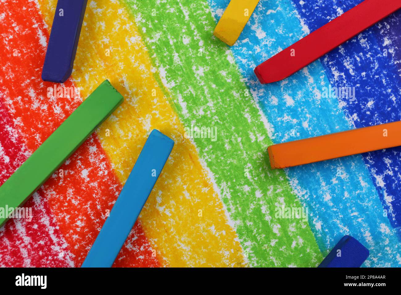 Colorful pastel chalks on drawing of rainbow, flat lay Stock Photo - Alamy