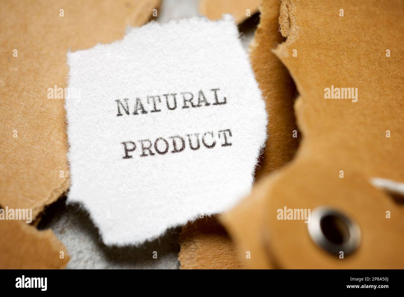 natural product text written on a small piece of paper Stock Photo - Alamy