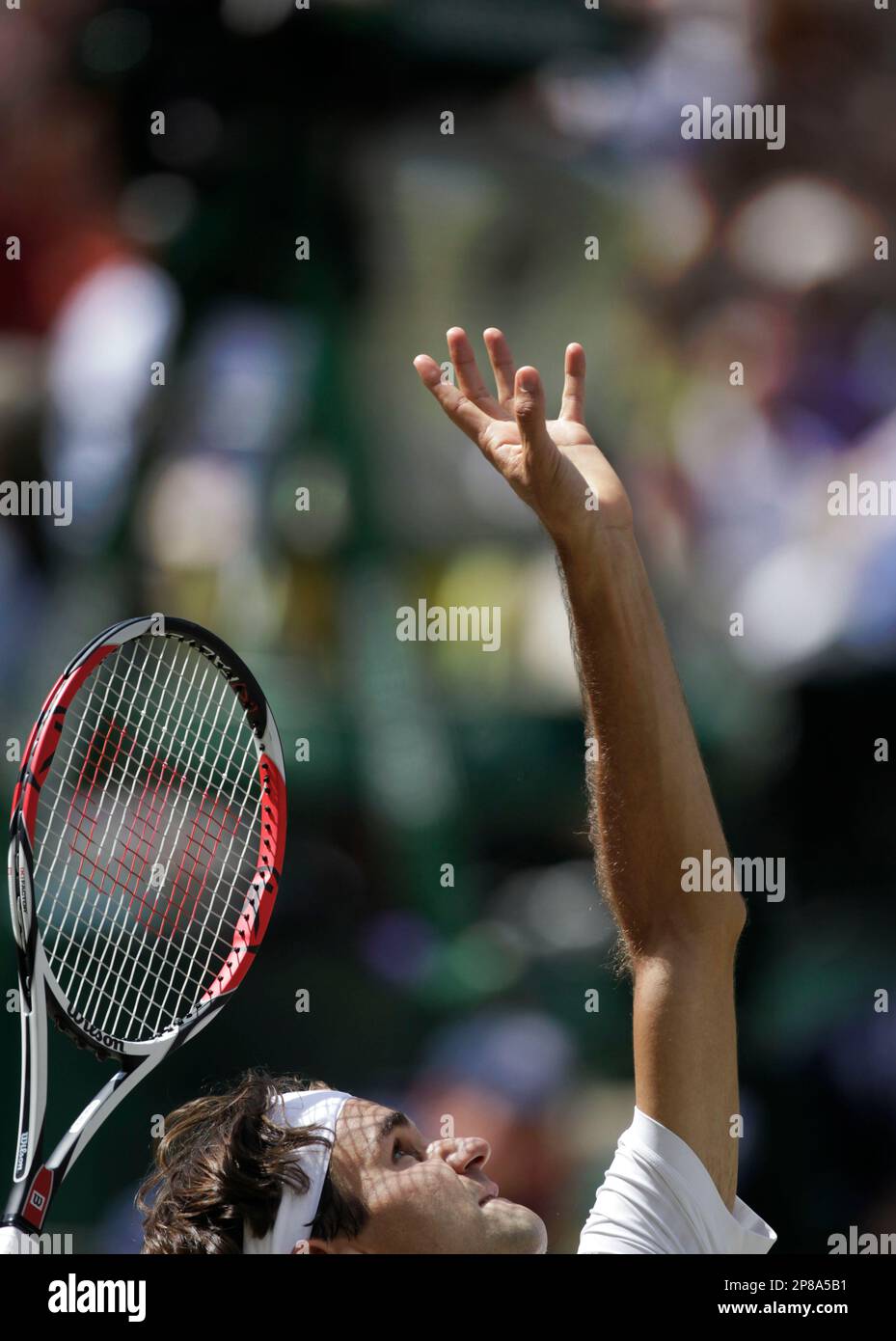 Roger Federer of Switzerland serves to Andy Roddick of U.S. during ...