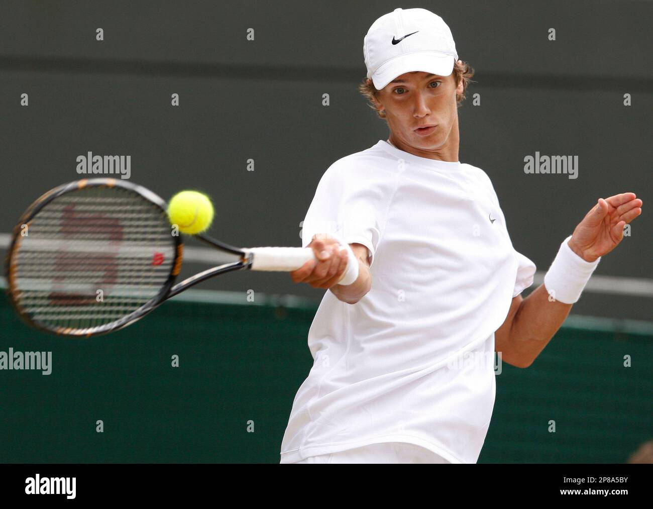 Andrey Kuznetsov of Russia returns to Jordan Cox of U.S. during their ...