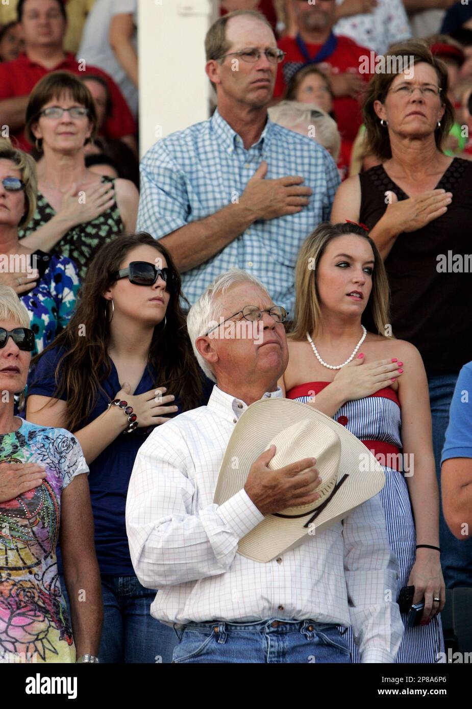 Tim Haines of Fargo, Okla., holds his cowboy hat in his hand during the ...