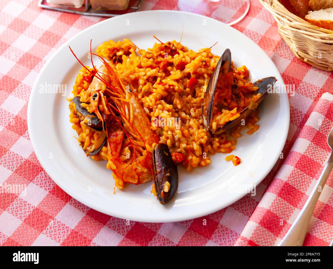 Spainsh dish seafood paella with rice, shrimps and mussels Stock Photo ...
