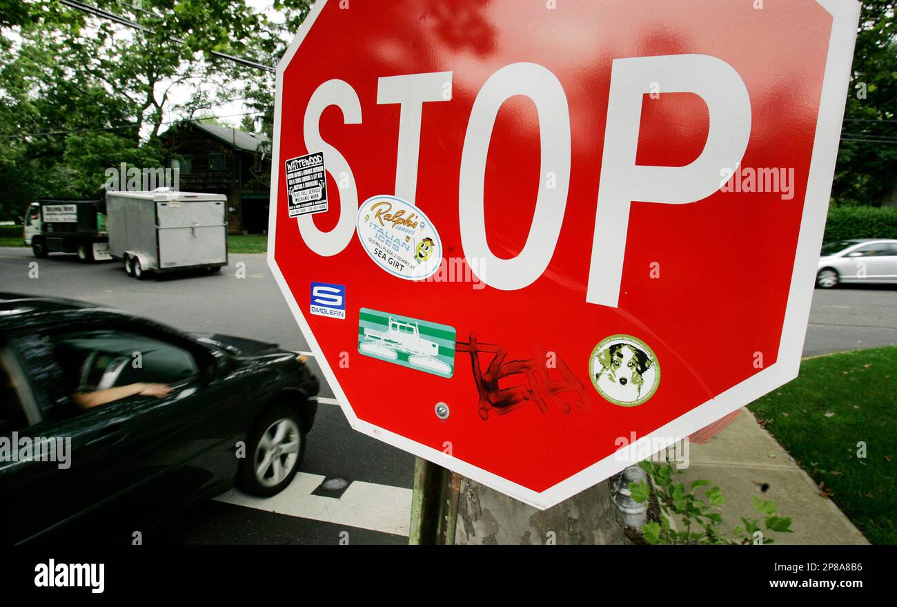 This June 23, 2009 photo shows stickers stuck to a stop sign in Brielle ...