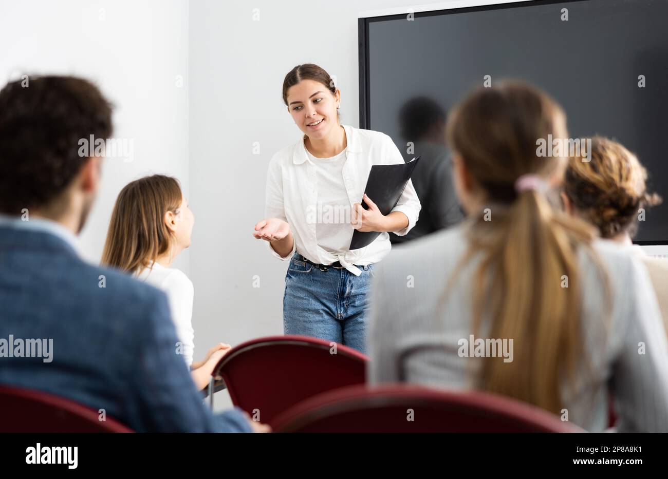 Female teacher explaining math students hi-res stock photography and ...